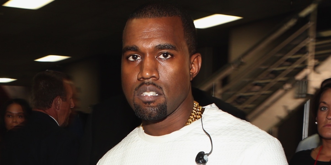 Kanye West attends Balenciaga fashion show wearing full face covering ...